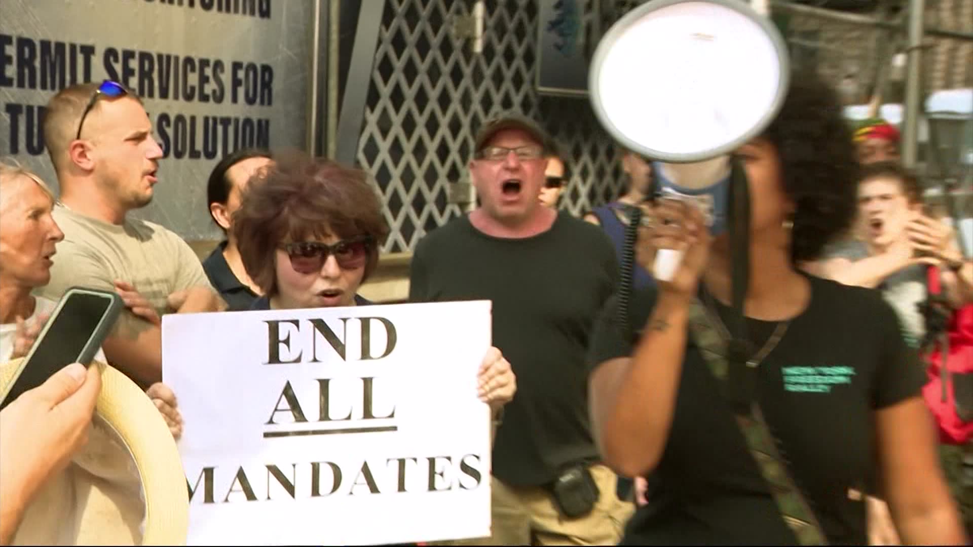 Protesters rally on 1-year anniversary of teacher vaccine mandate rally