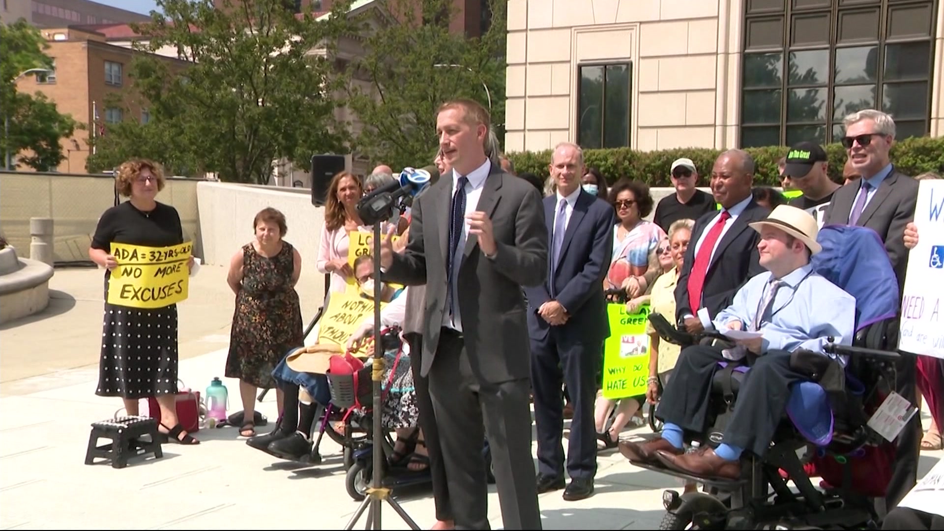 Disability rights activists rally over Lyft’s lack of wheelchair ...