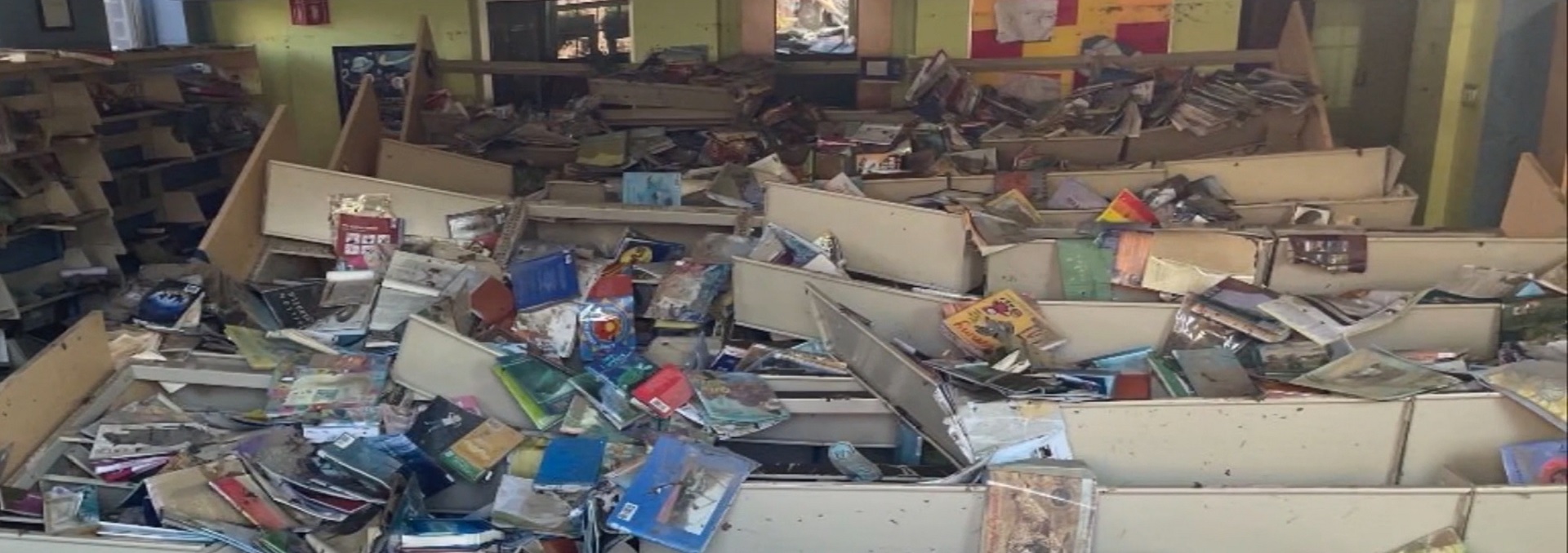 Photos show toppled bookshelves, ruined books from flood-devastated ...