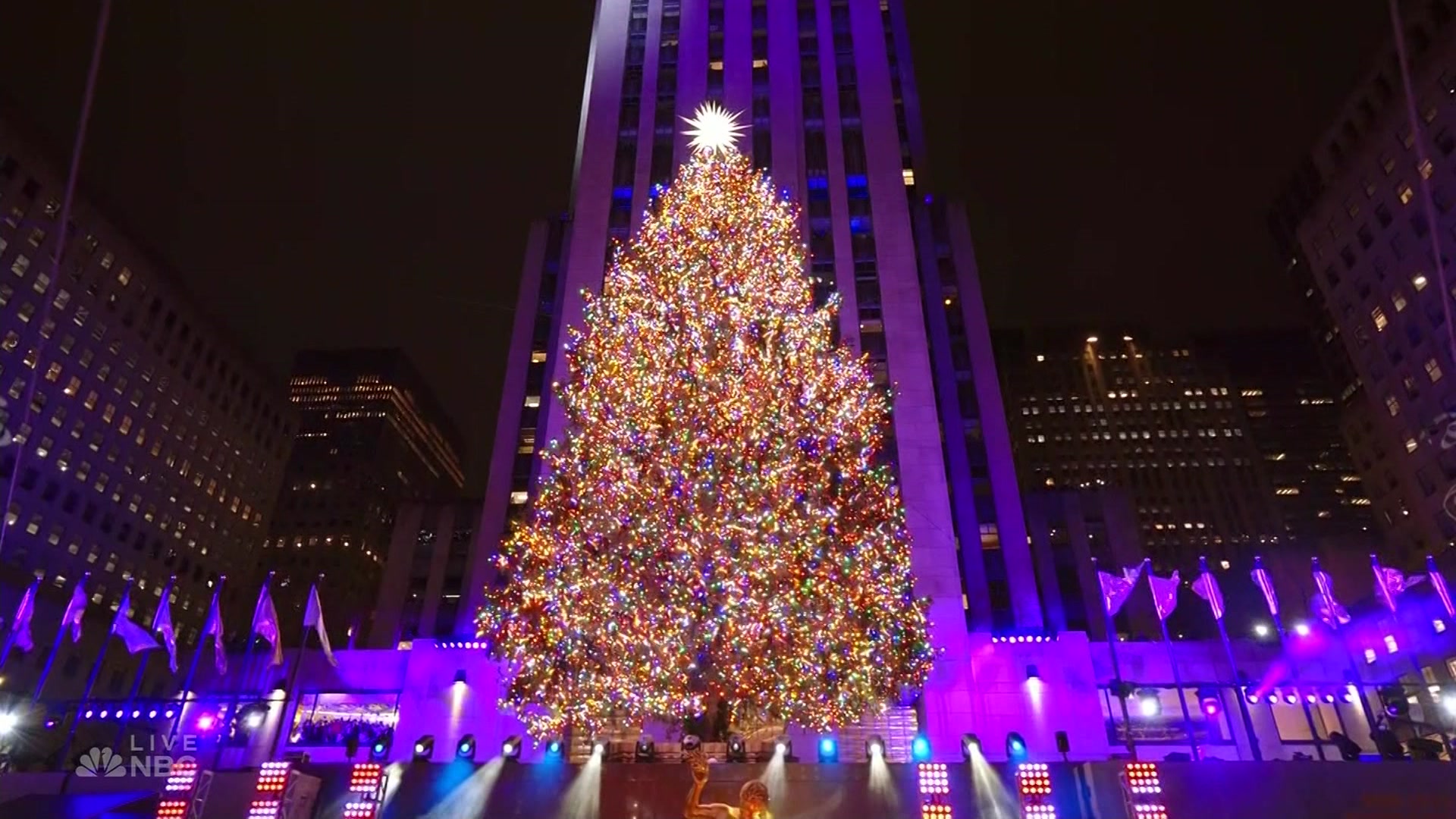 Iconic Christmas tree at Rockefeller Center illuminated in midst of pro ...