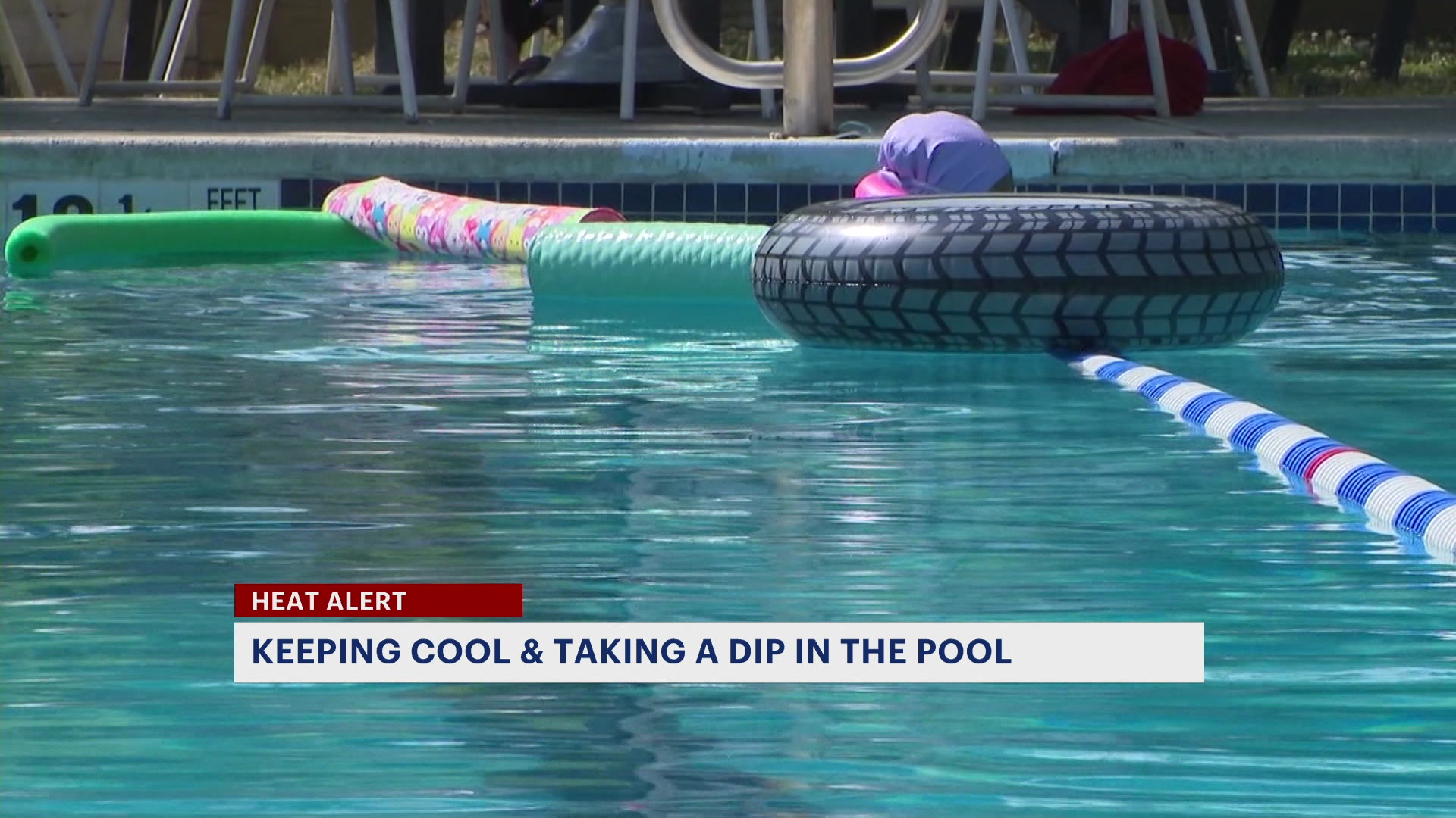 Cooling off at the local pool on the 5th day of a heat wave in New Jersey
