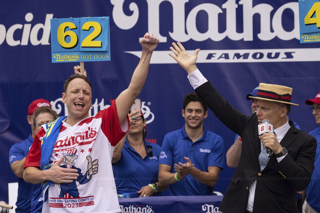 Dog fight! Joey Chestnut out of July 4 hot dog eating contest due to ...