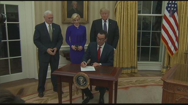 Some critical of treasury secretary's dollar bill signature