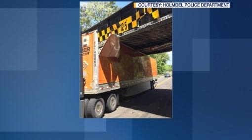 Tractor-trailer gets stuck under railroad bridge in Homdel