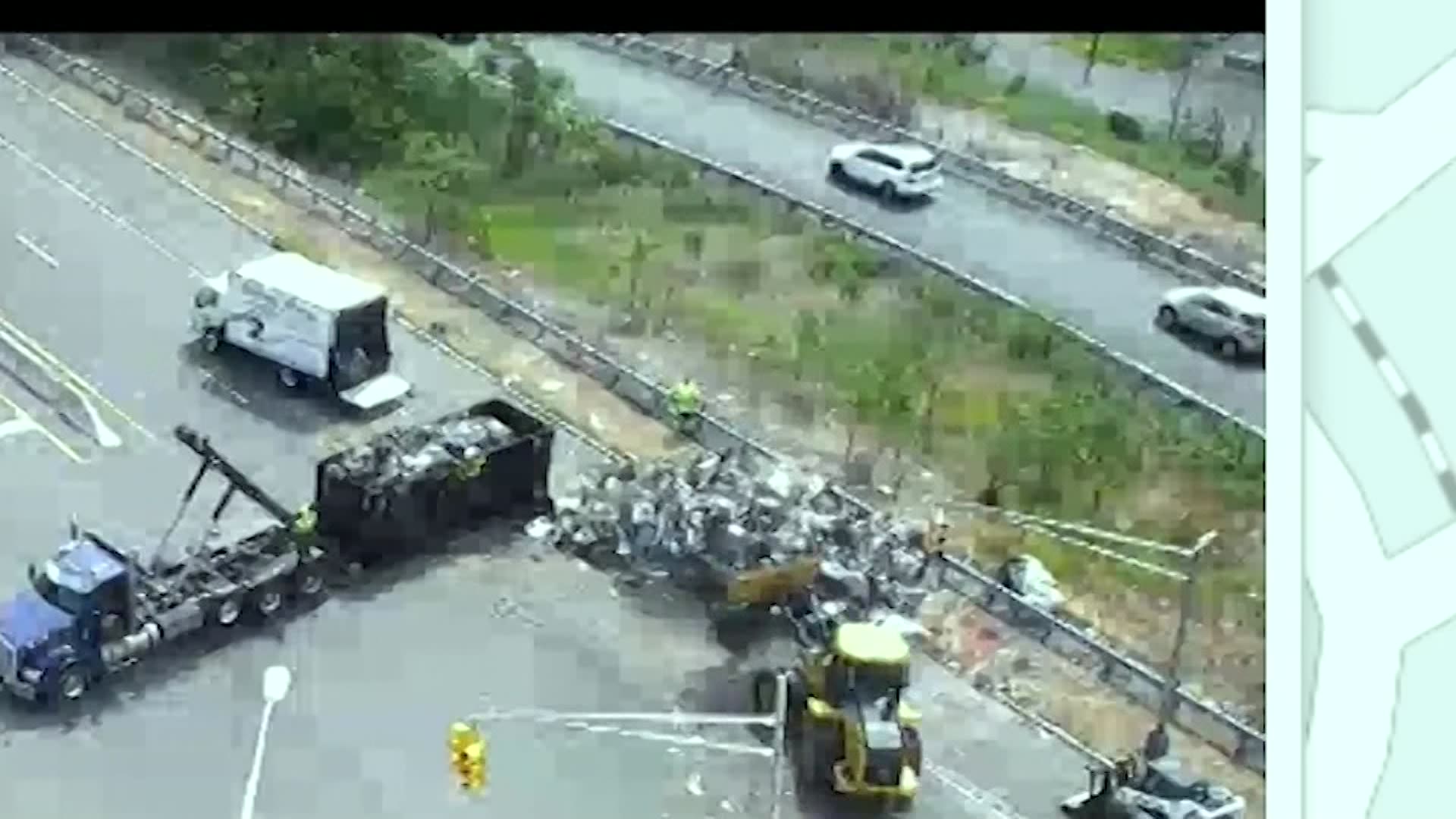 Overturned truck spills debris all over parts of Route 185 in Jersey City
