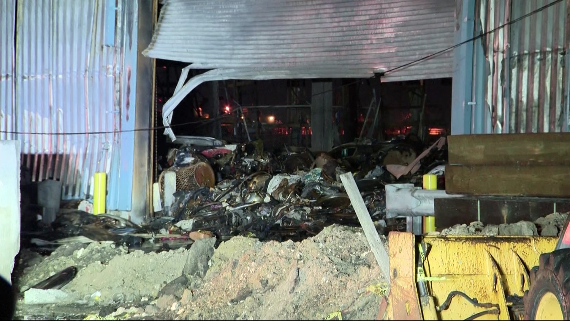 FDNY: Large fire at NYPD auto pound in Red Hook persists; 8 injured